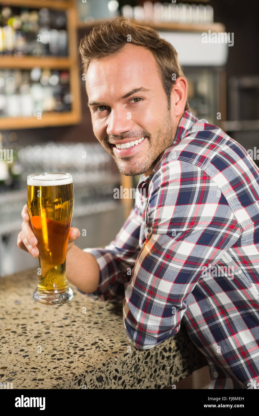 Handsome man having a beer Stock Photo - Alamy