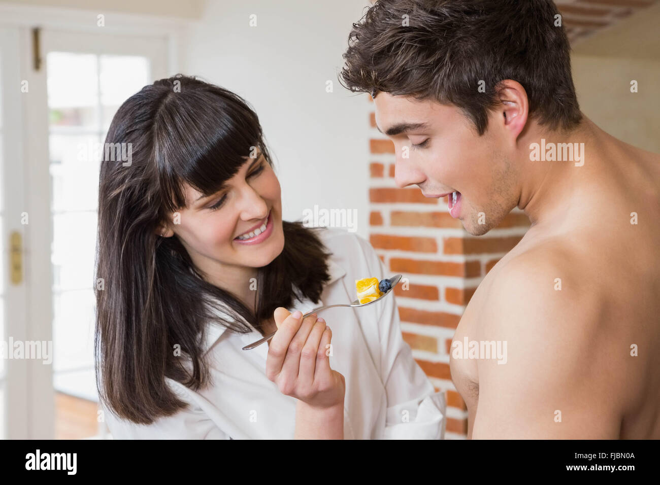 Woman spoon feeding man hi-res stock photography and images - Alamy