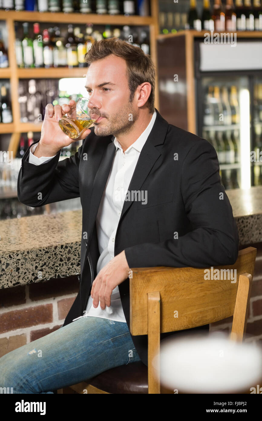 Handsome man having a whiskey Stock Photo - Alamy