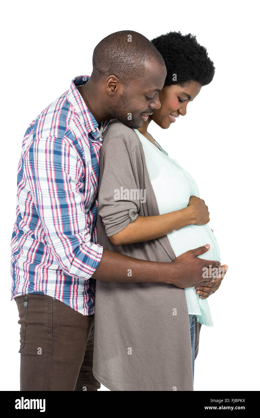 Man touching pregnant womans stomach Stock Photo - Alamy