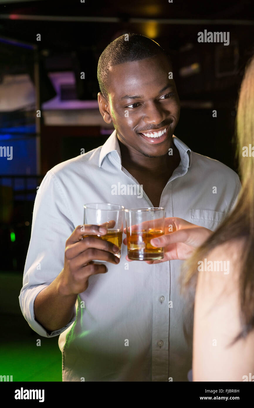 Man toasting his whisky glass Stock Photo - Alamy