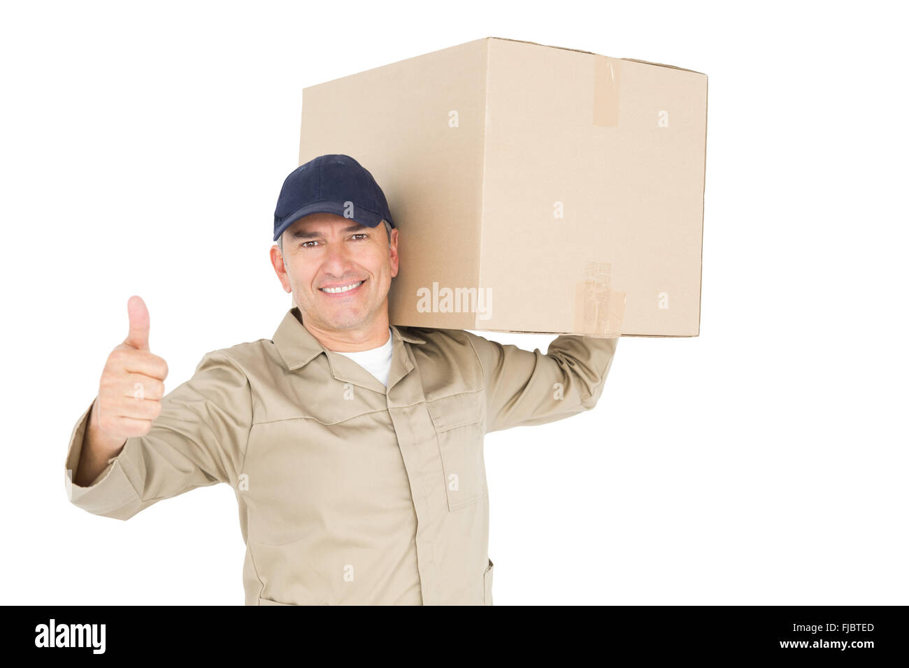 Delivery man carrying a package and showing a thumbs up Stock Photo - Alamy