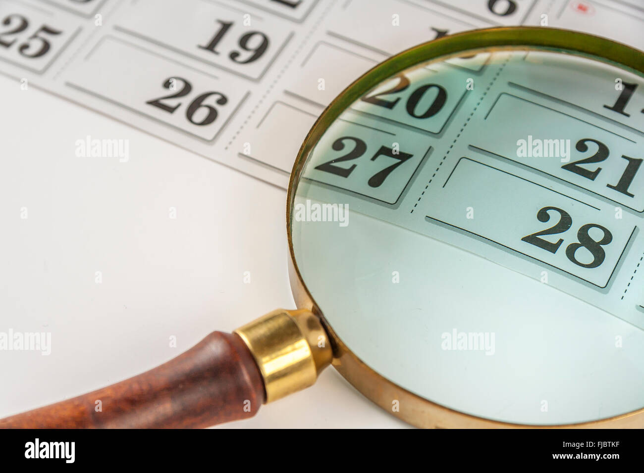 Magnifying Glass on Calendar Stock Photo - Alamy