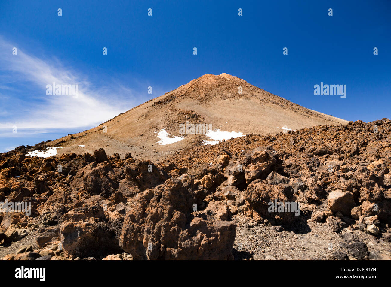 Lava rocks, behind volcano Pico del Teide, Tenerife, Canary Islands ...