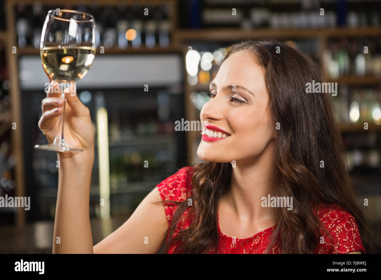Pretty woman having a glass of wine Stock Photo - Alamy