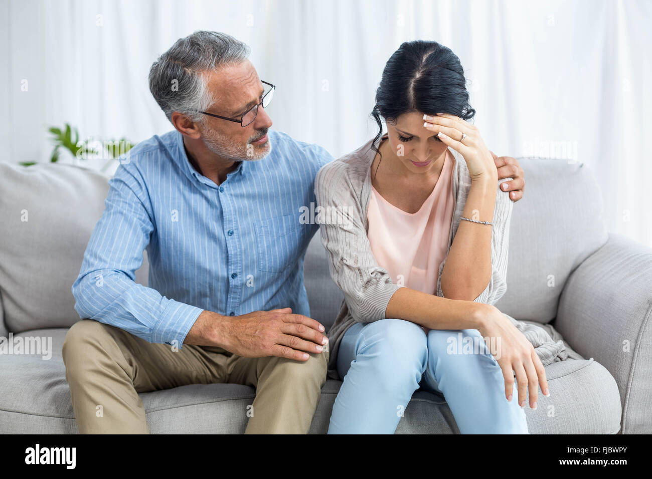 Mature woman consoling sad hi-res stock photography and images - Alamy