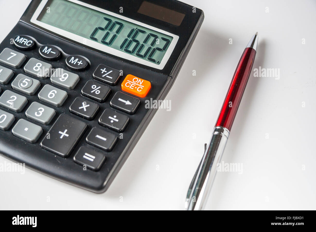 Calculator And Pen Stock Photo - Alamy