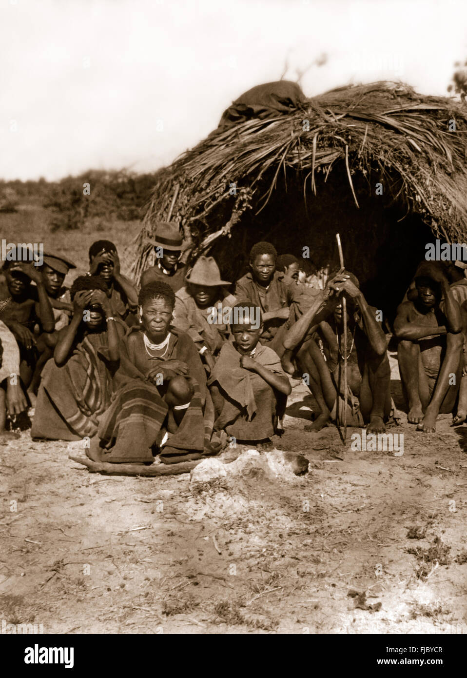 Historical photo of 1918, Bushmen families in front of a hut, former ...