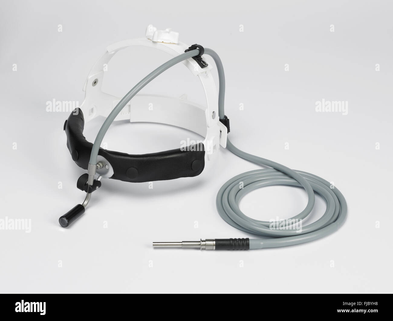 Medical micro camera and helmet isolated on white. Horizontal Stock ...