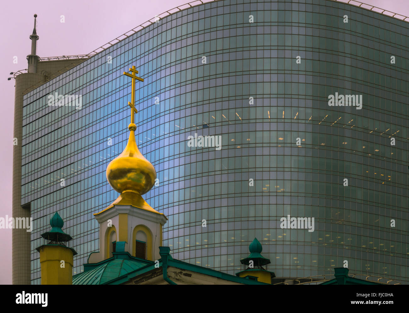Church on a background of a modern high-rise building Stock Photo - Alamy