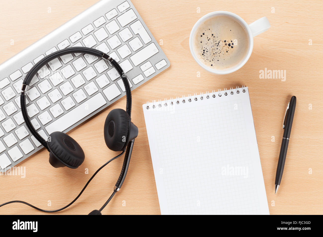 Office desk with headset and pc. Call center support table. Top veiw ...