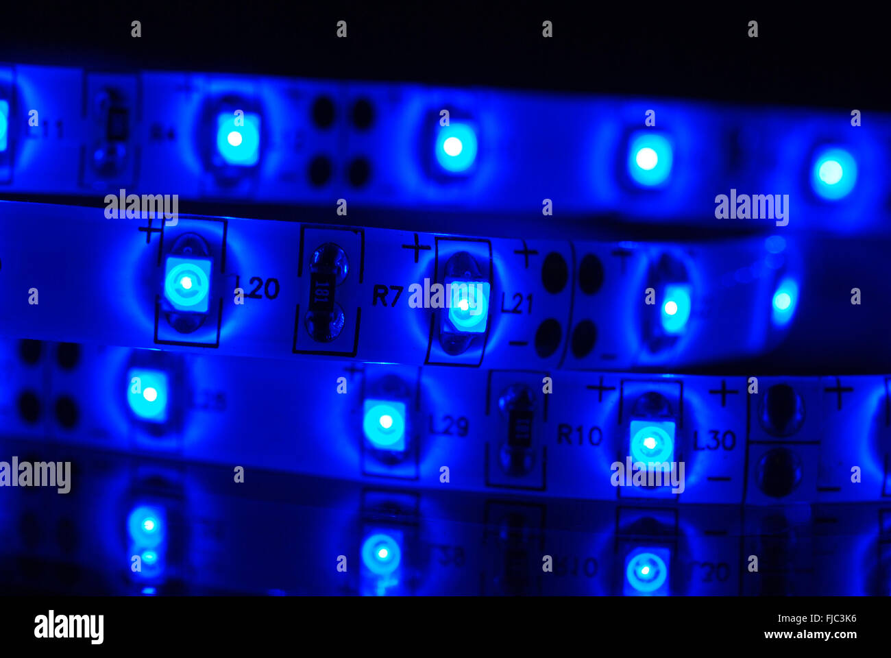 Blue led strip on the black background Stock Photo - Alamy