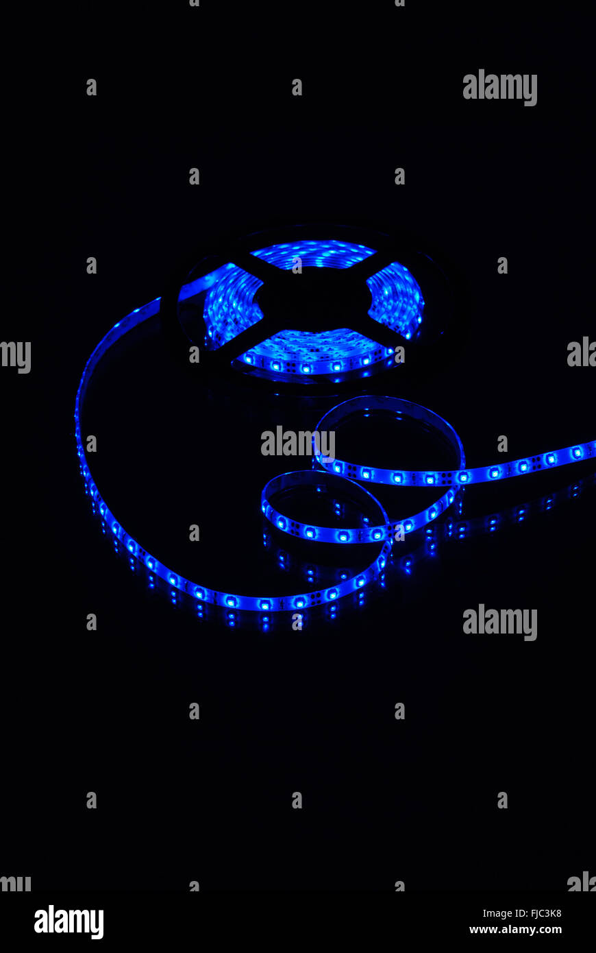Blue led strip on the black background Stock Photo - Alamy