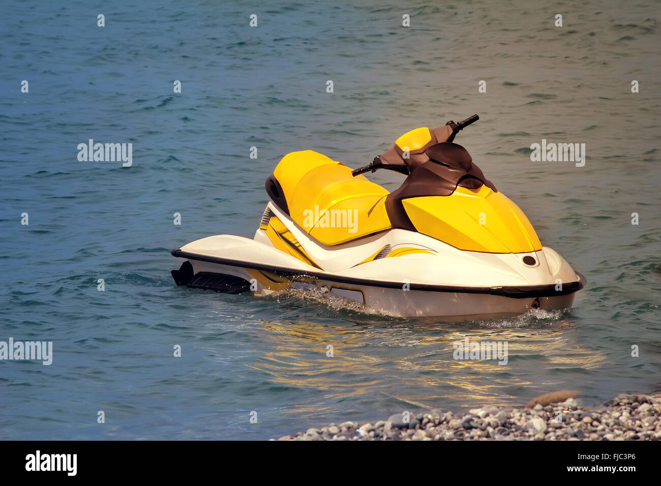 In coastal water on the beach is a small single motor boat vacationers ...