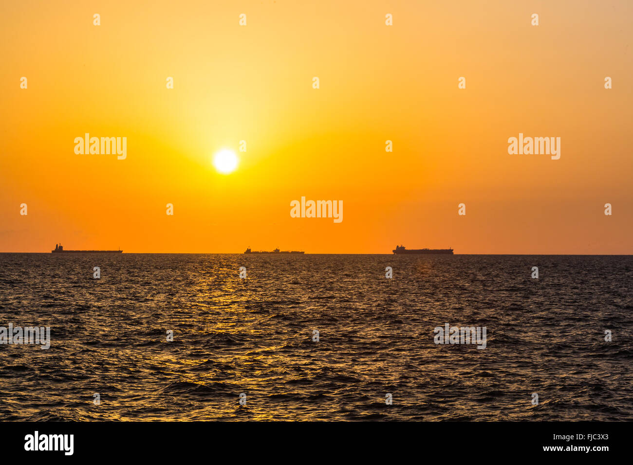 maritime landscape, large ships on sunset background Stock Photo - Alamy