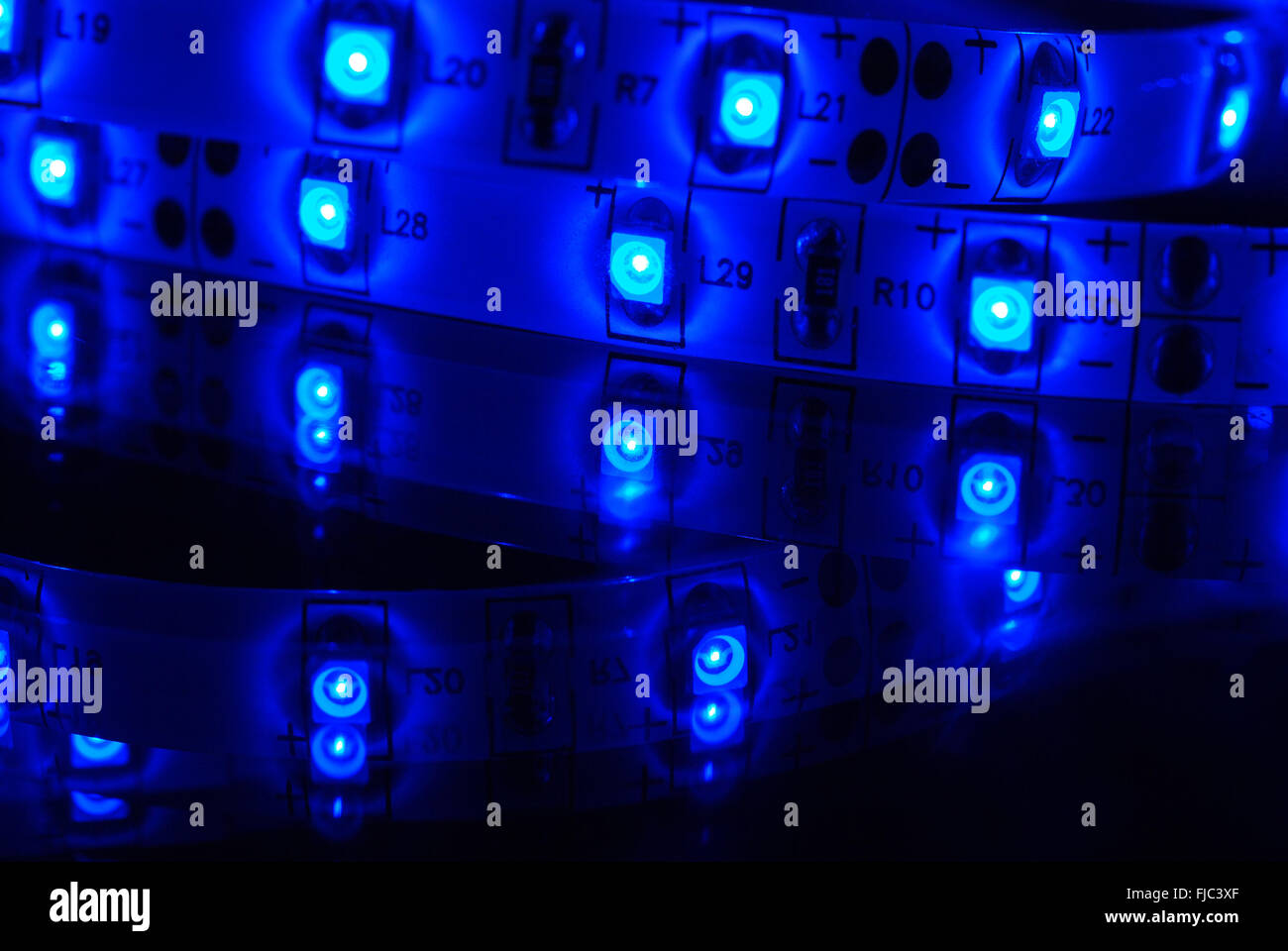 Blue led strip on the black background Stock Photo - Alamy
