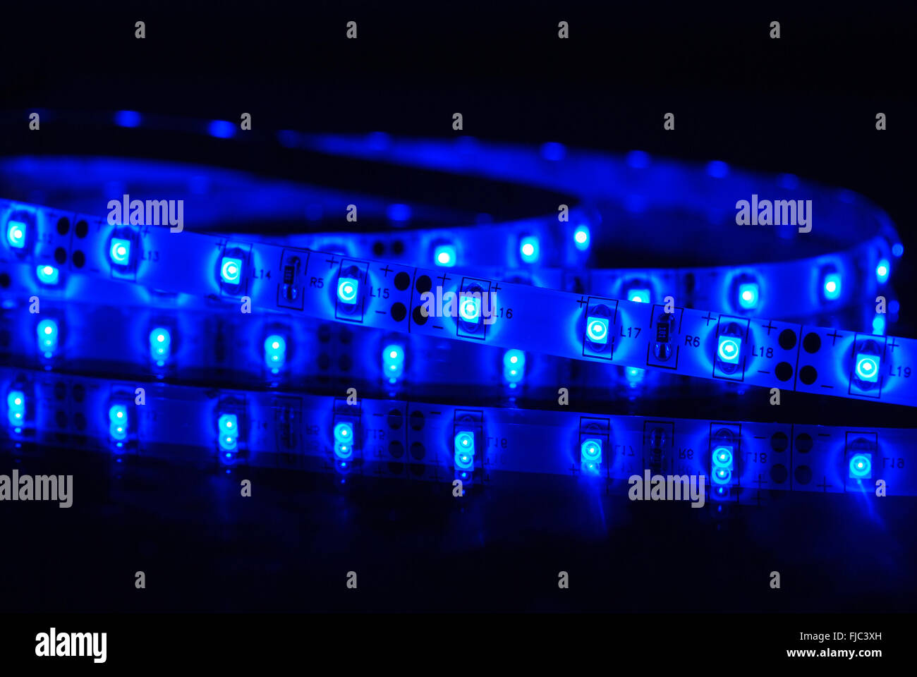 Blue led strip on the black background Stock Photo - Alamy