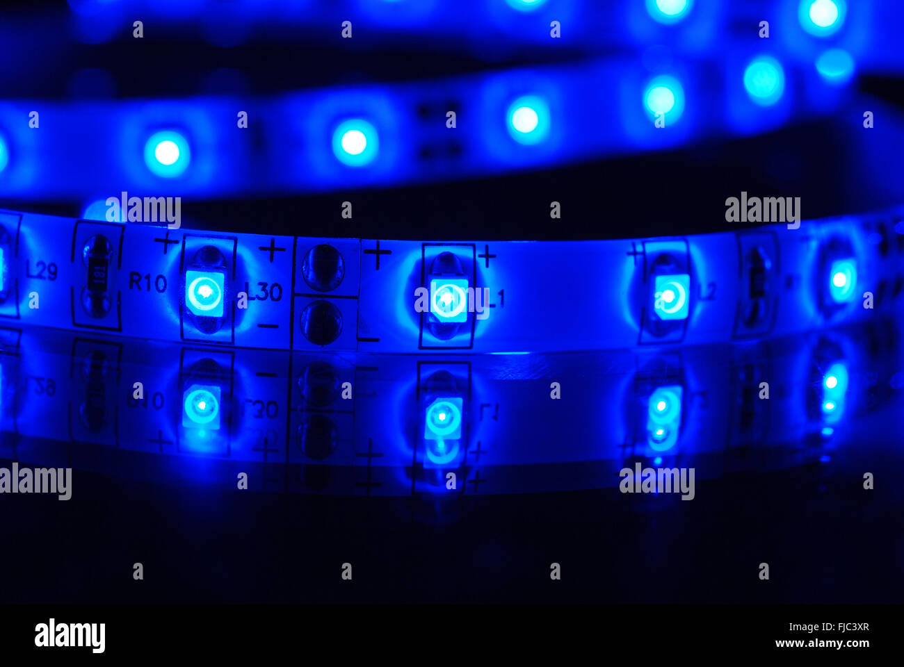 Blue led strip on the black background Stock Photo - Alamy