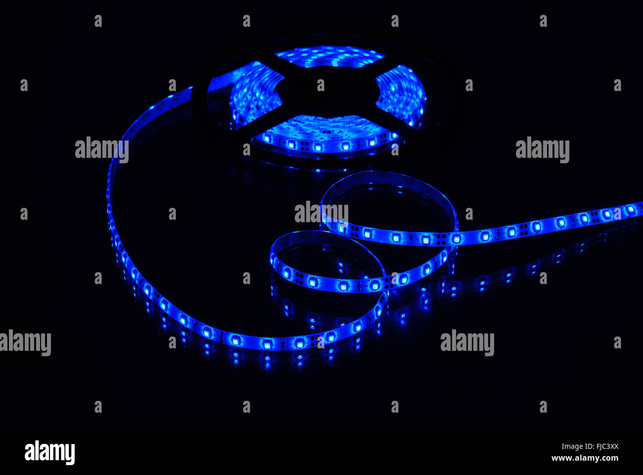 Blue led strip on the black background Stock Photo - Alamy