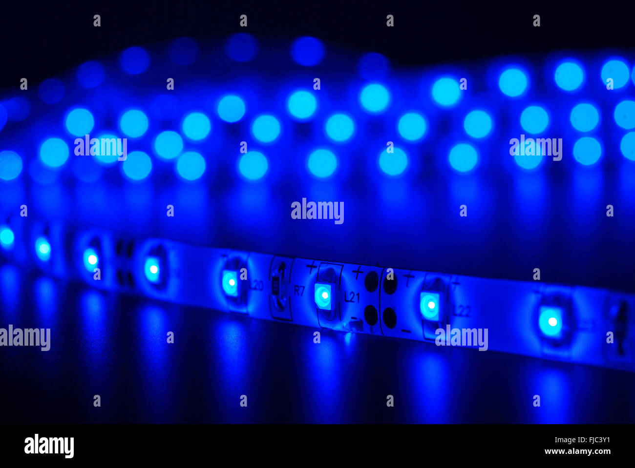 Blue led strip on the black background Stock Photo - Alamy