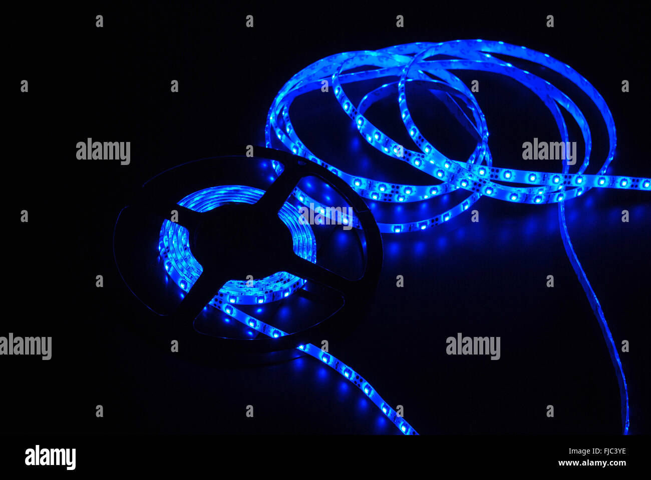 Blue led strip on the black background Stock Photo - Alamy