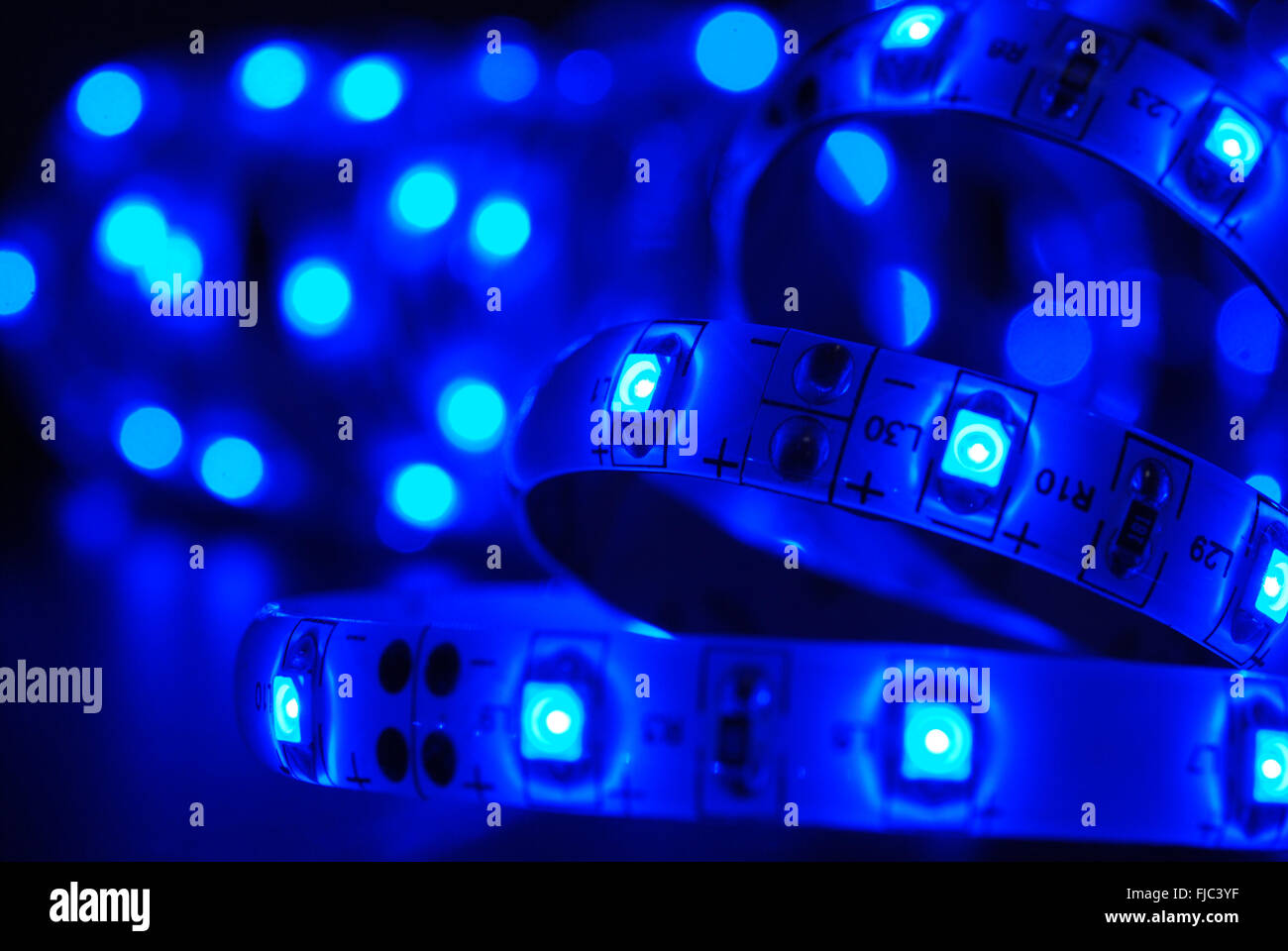 Blue led strip on the black background Stock Photo - Alamy