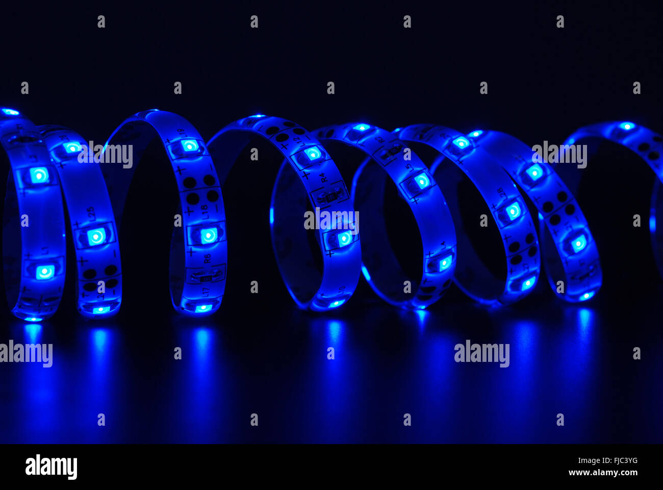 Blue led strip on the black background Stock Photo - Alamy