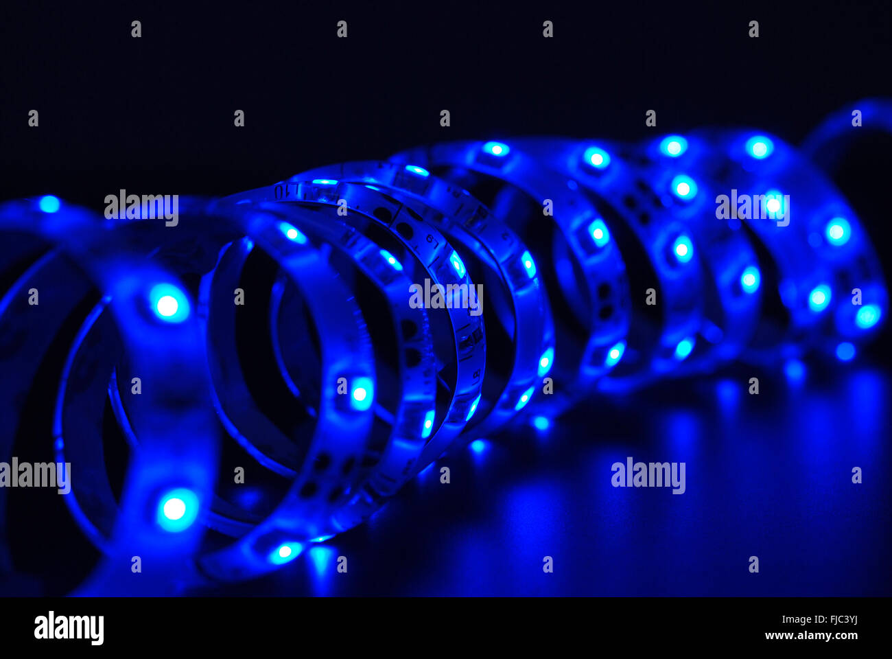 Blue led strip on the black background Stock Photo - Alamy