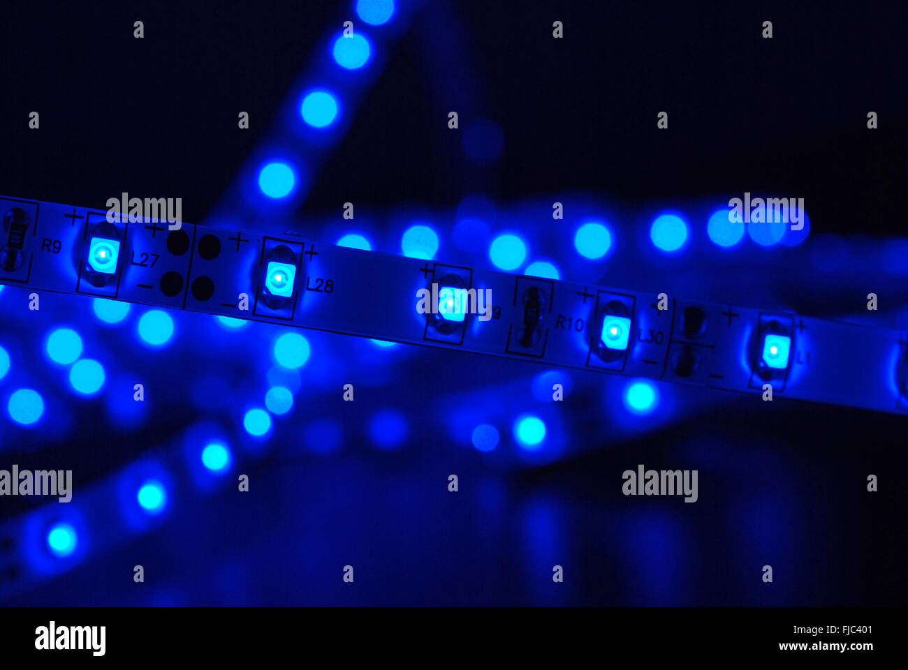 Blue led strip on the black background Stock Photo - Alamy