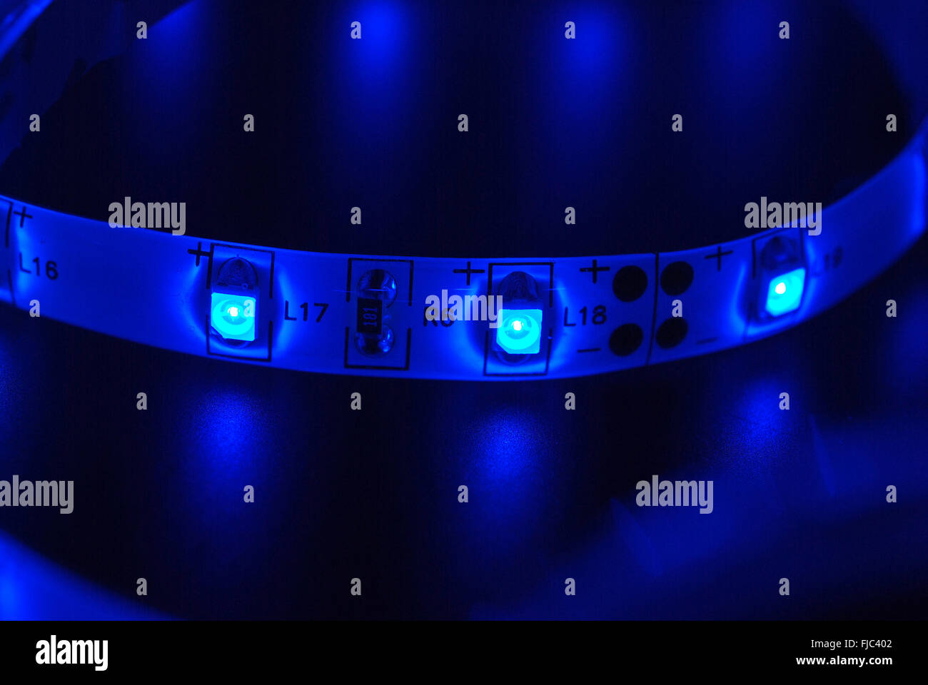 Blue led strip on the black background Stock Photo - Alamy