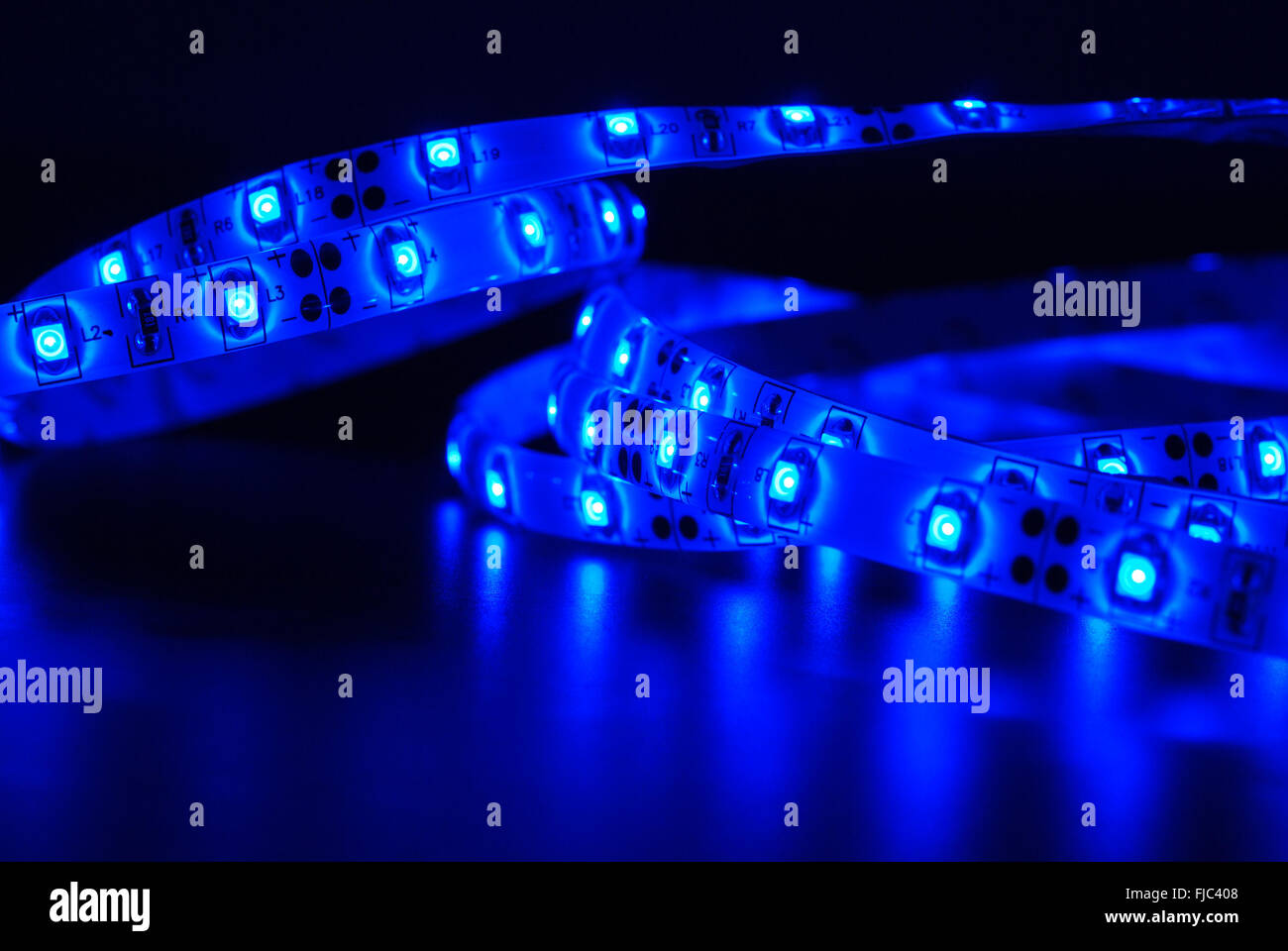 Blue led strip on the black background Stock Photo - Alamy