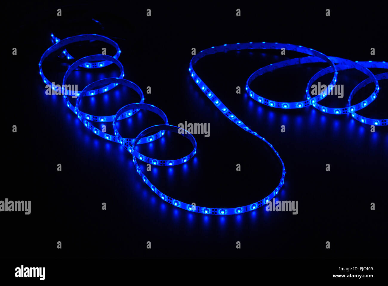 Blue led strip on the black background Stock Photo - Alamy