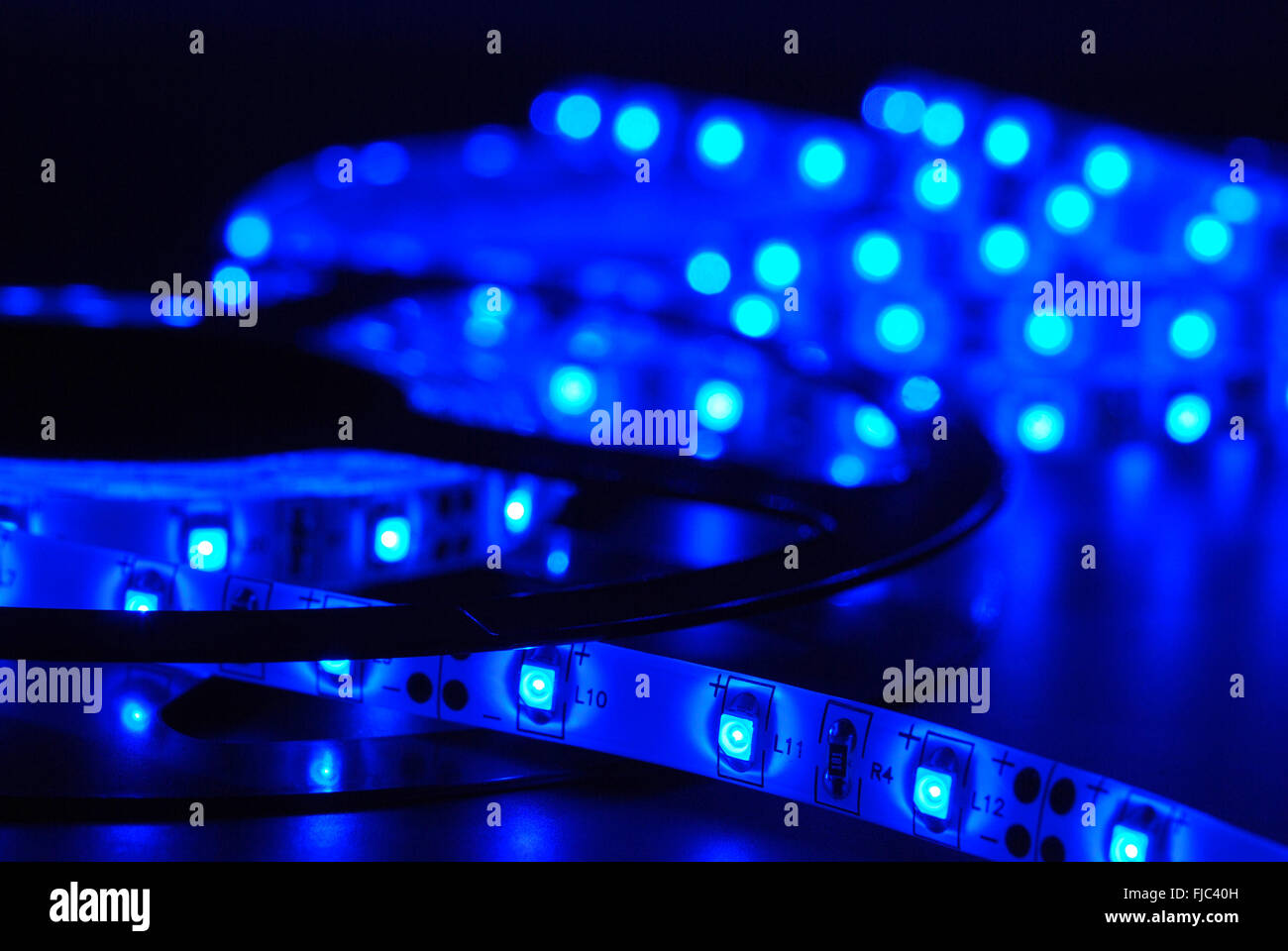 Blue led strip on the black background Stock Photo - Alamy