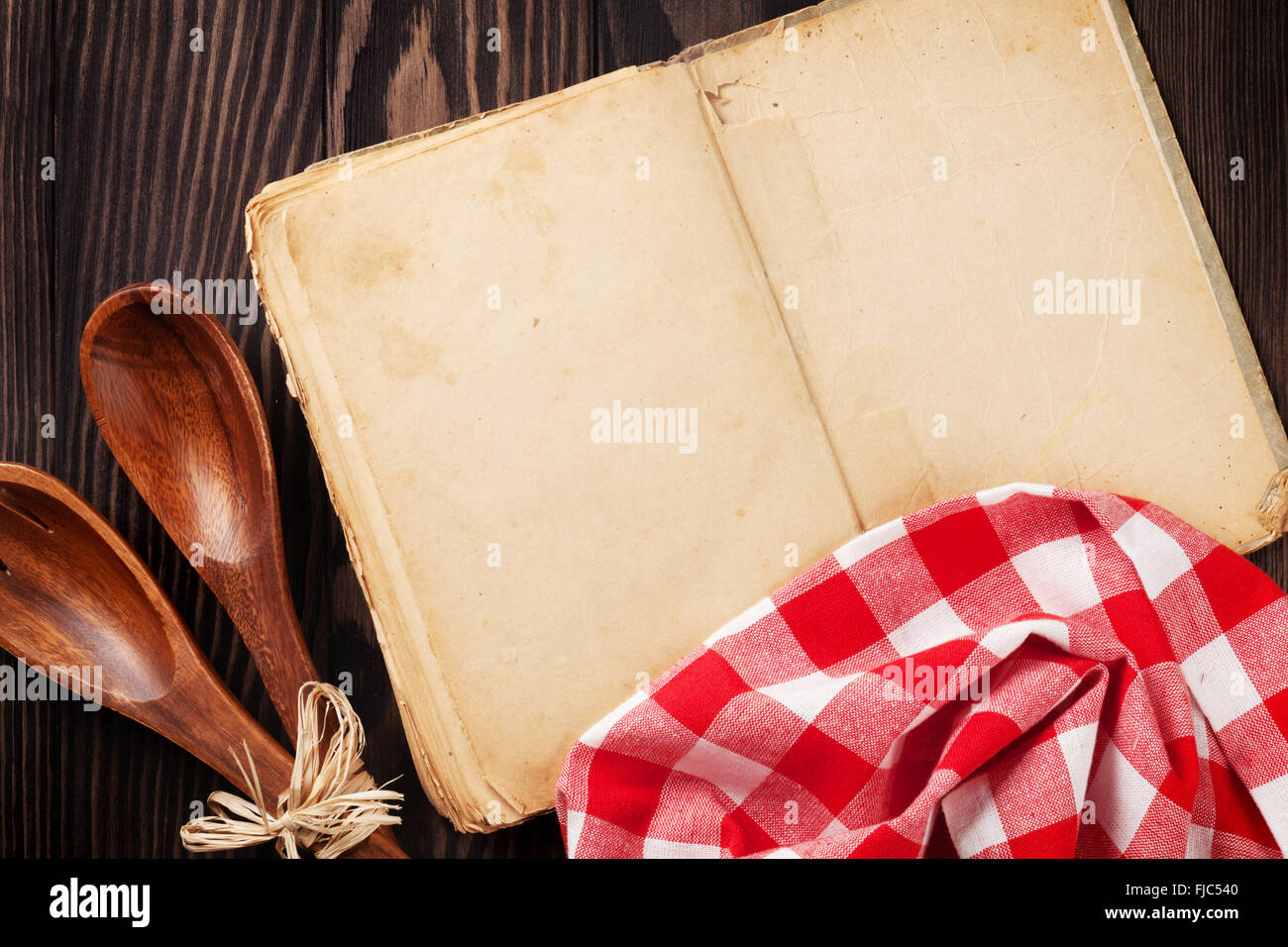 Blank vintage recipe cooking book and utensils on wooden table. Top ...