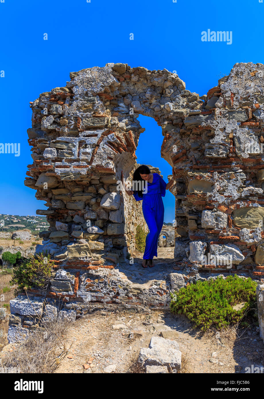 beautiful greek young brunet woman in blue dress Stock Photo - Alamy