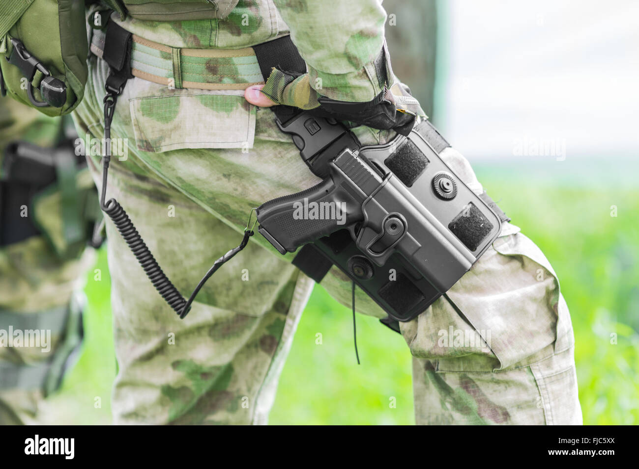Military man gun on leg hi-res stock photography and images - Alamy
