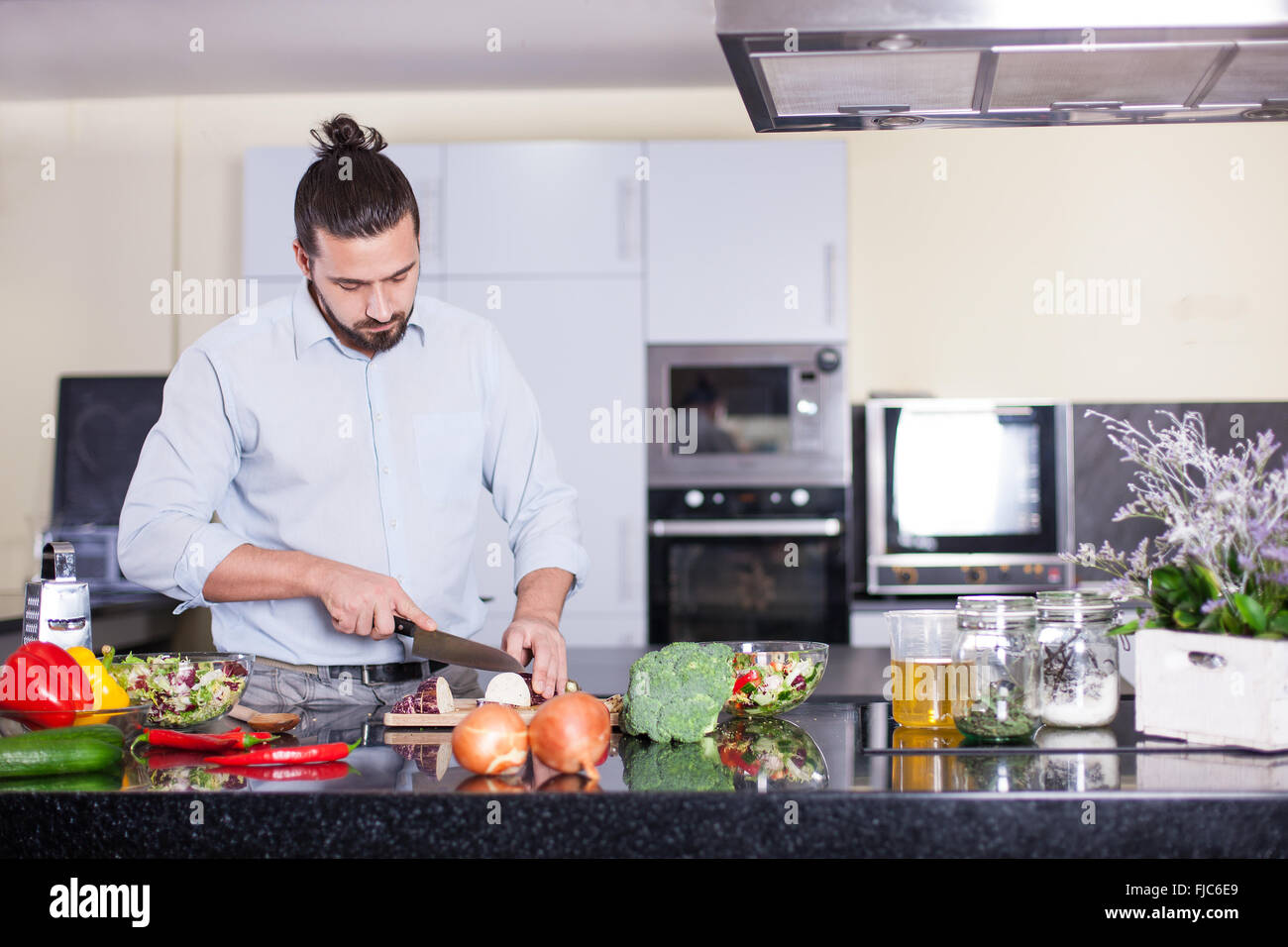 Man in kitchen Stock Photo - Alamy