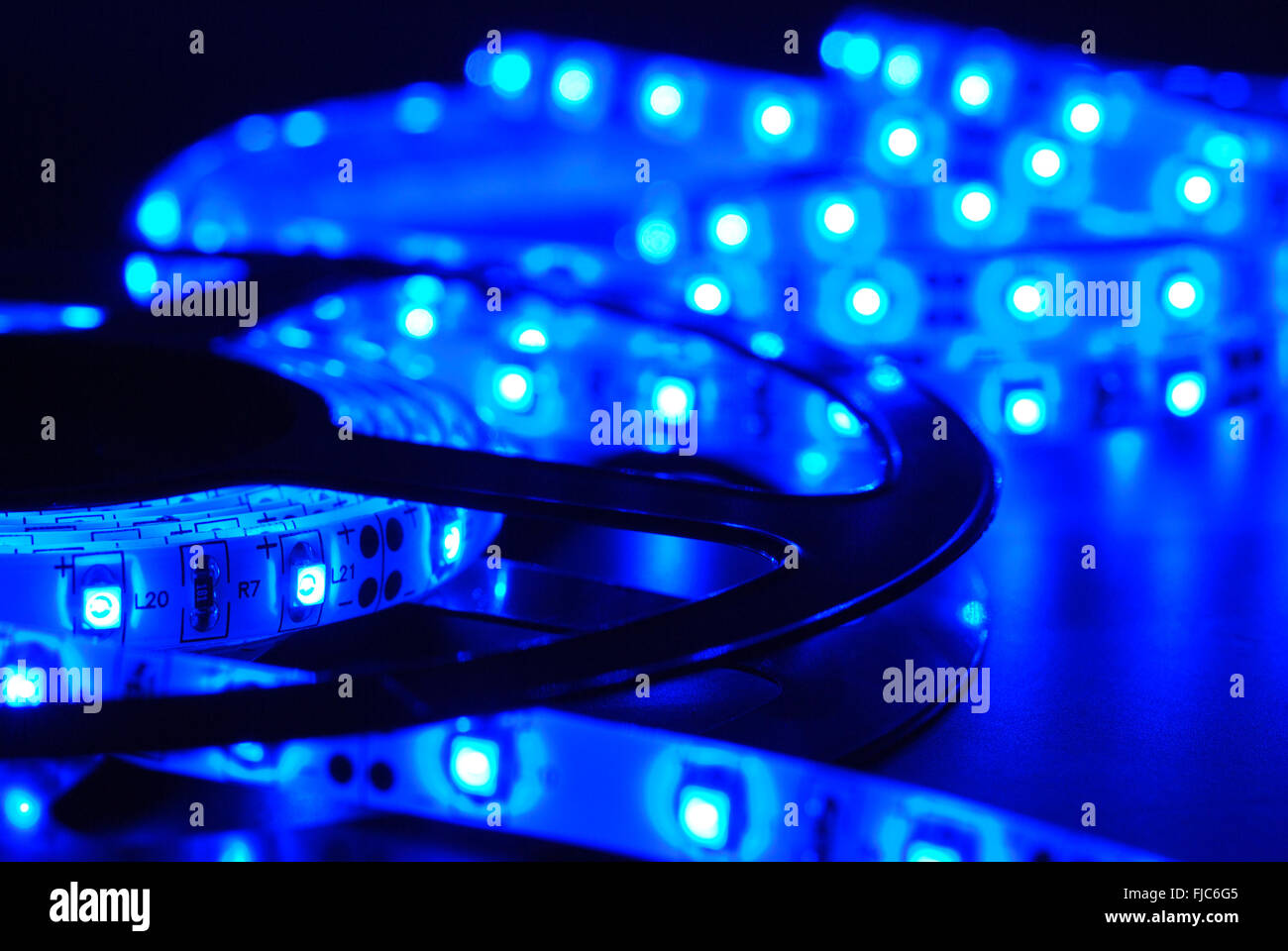 Blue led strip on the black background Stock Photo - Alamy
