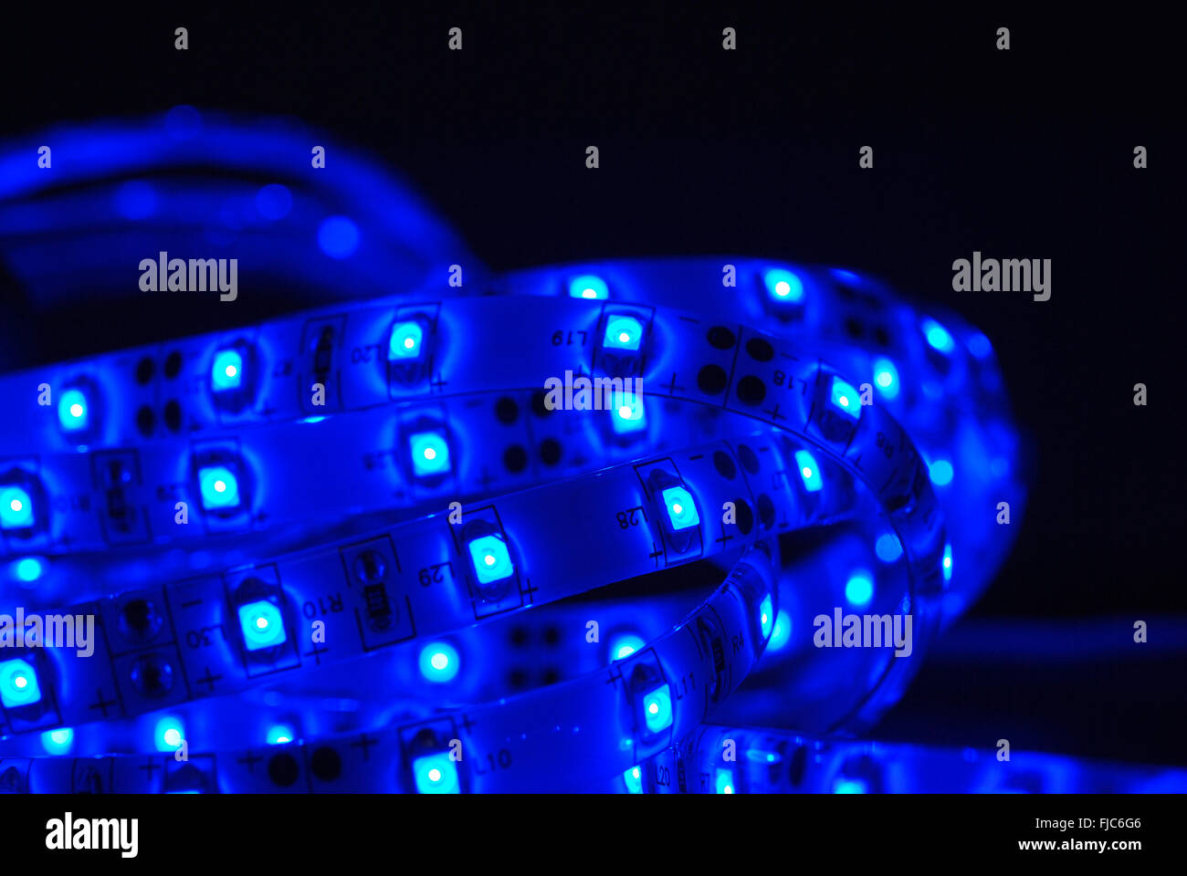 Blue led strip on the black background Stock Photo - Alamy