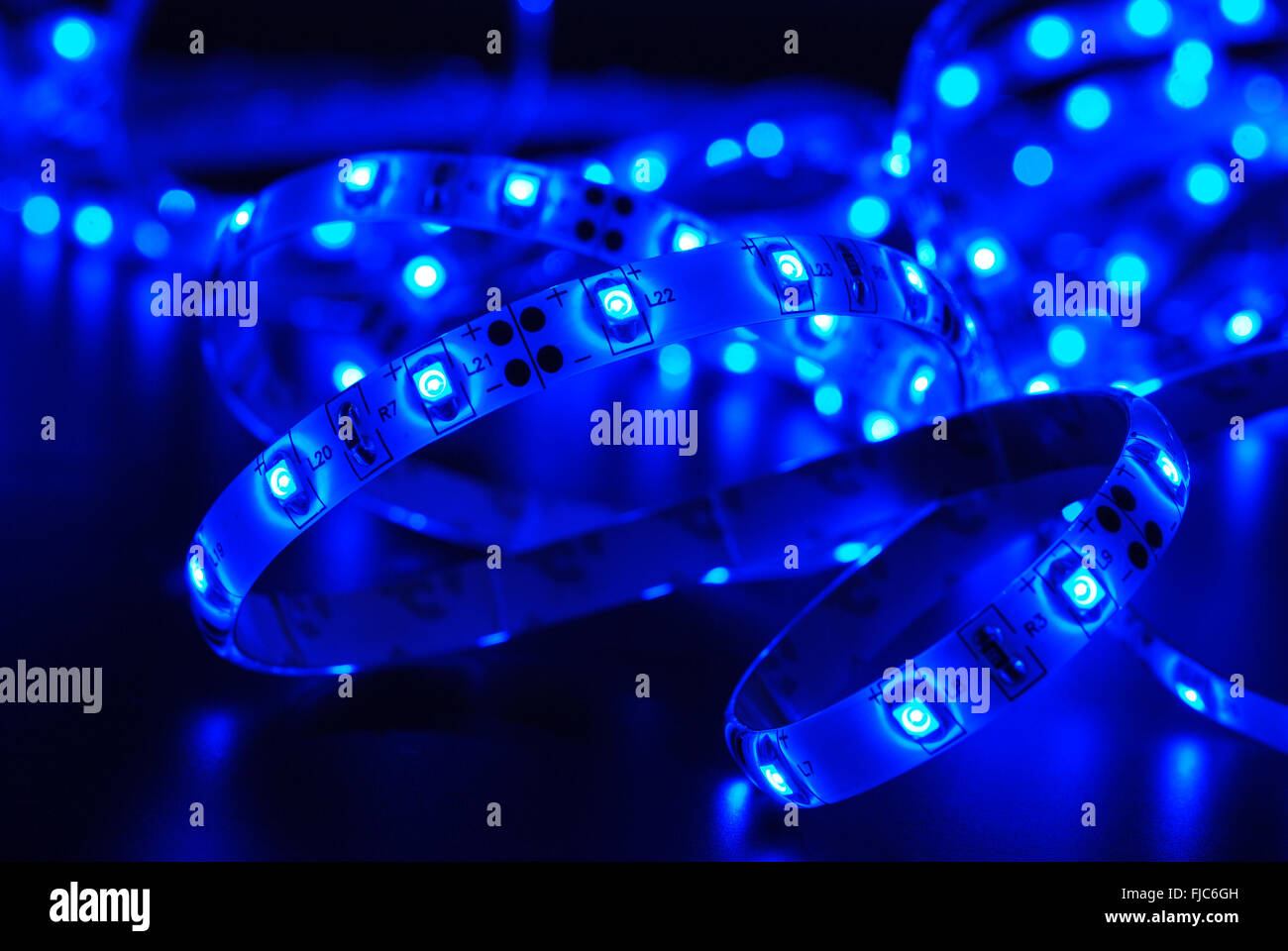 Blue led strip on the black background Stock Photo - Alamy