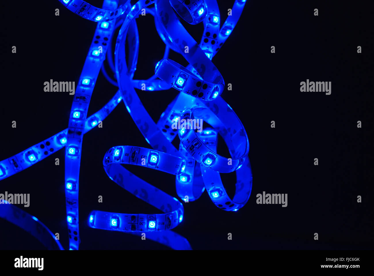 Blue led strip on the black background Stock Photo - Alamy