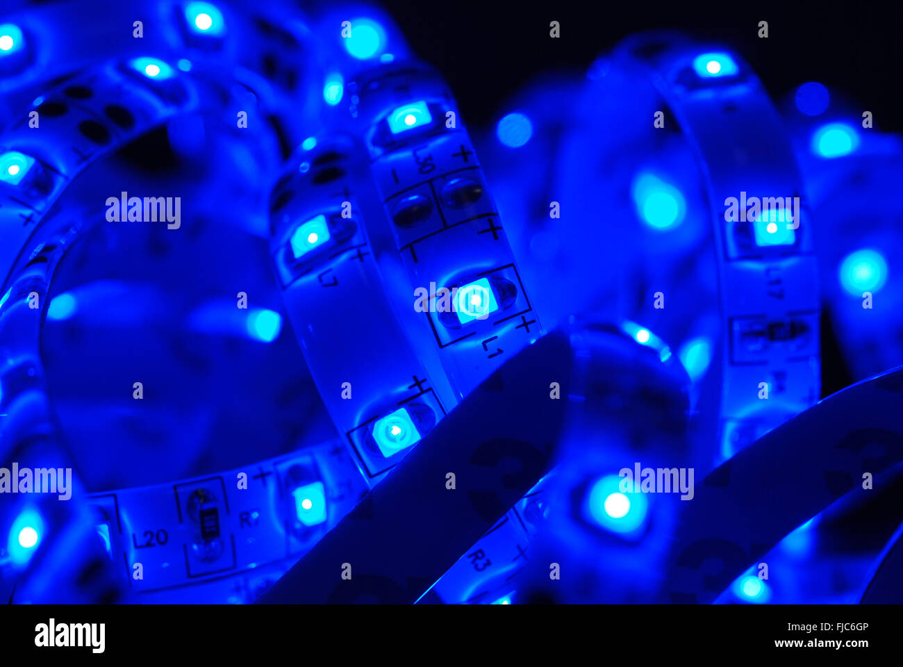 Blue led strip on the black background Stock Photo - Alamy