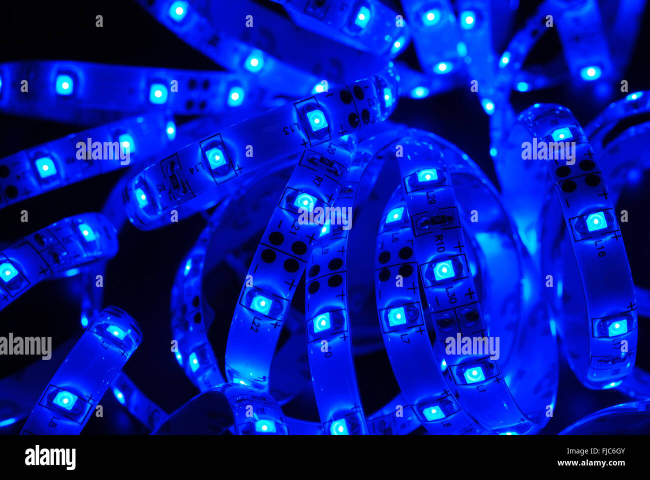 Blue led strip on the black background Stock Photo - Alamy