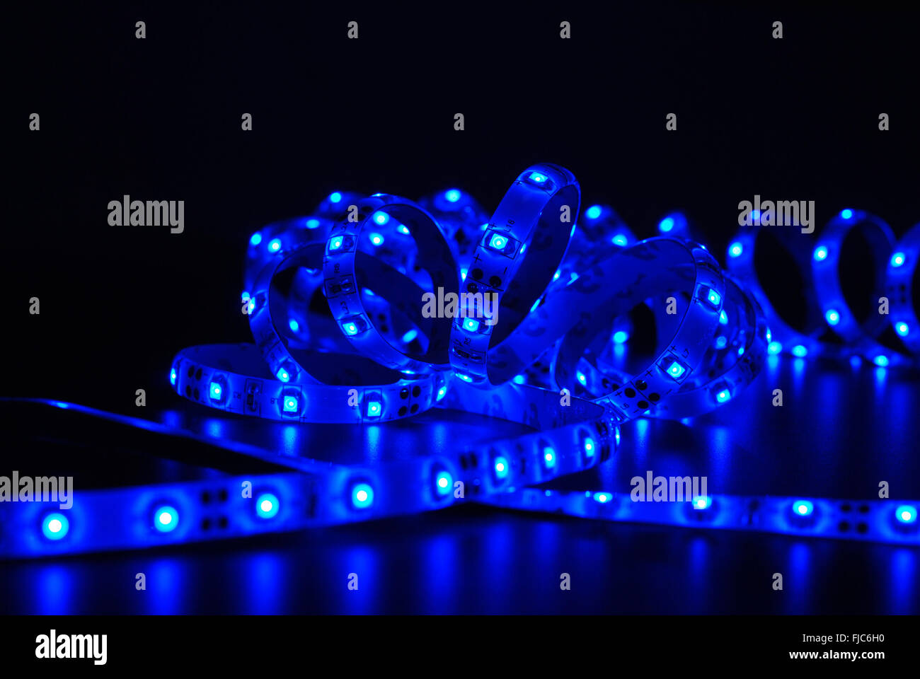 Blue led strip on the black background Stock Photo - Alamy
