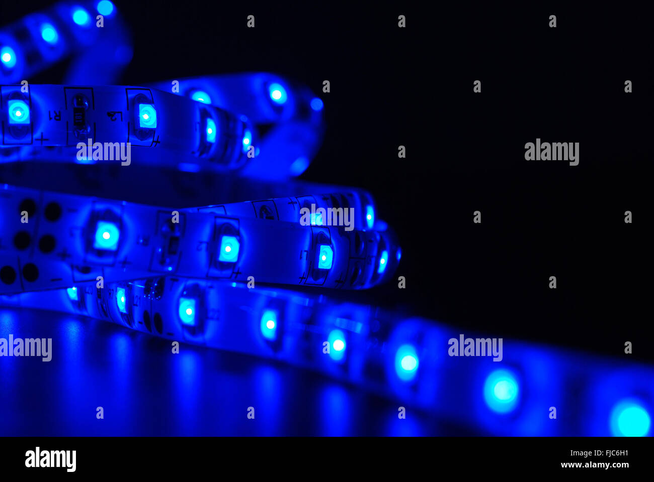 Blue led strip on the black background Stock Photo - Alamy