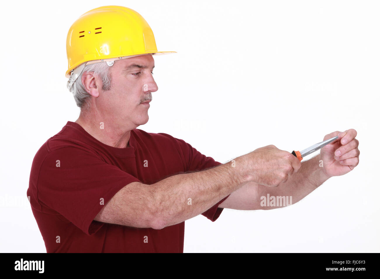 Handyman using screwdriver Stock Photo - Alamy