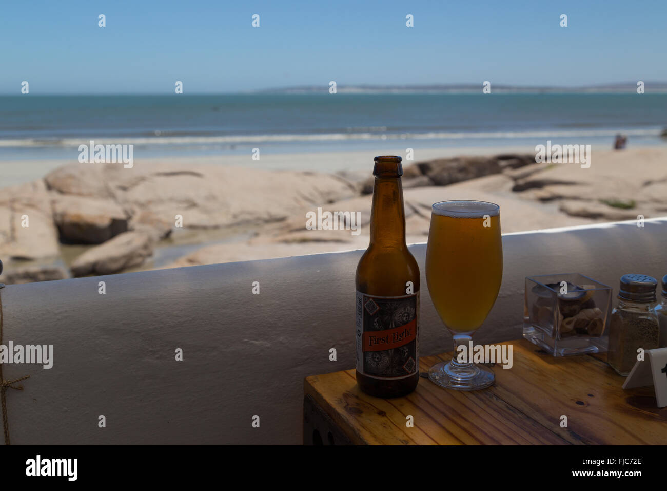 Craft beer overlooking the beach Stock Photo - Alamy