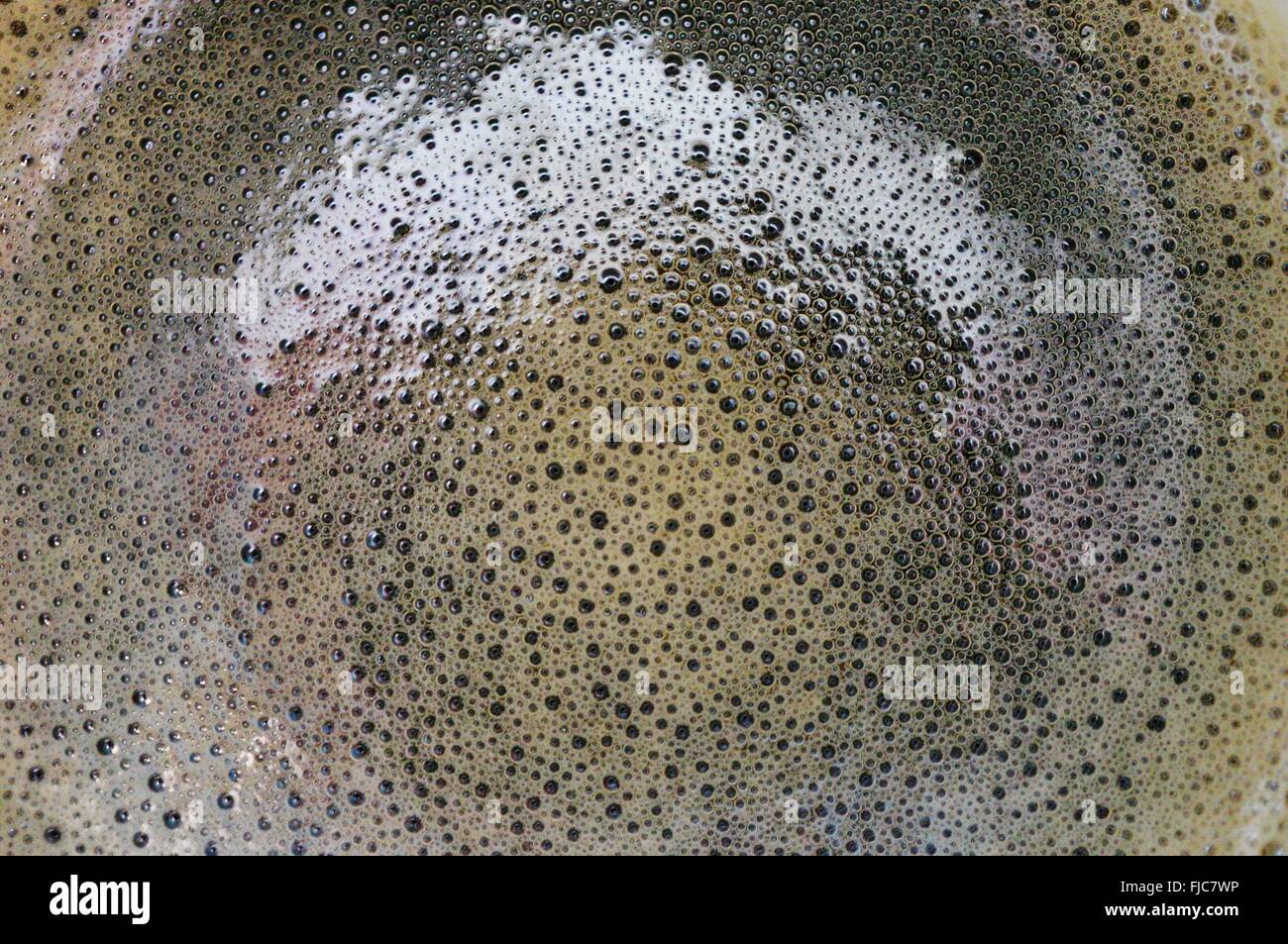 The texture at the top surface of a cup of strong coffee Stock Photo ...