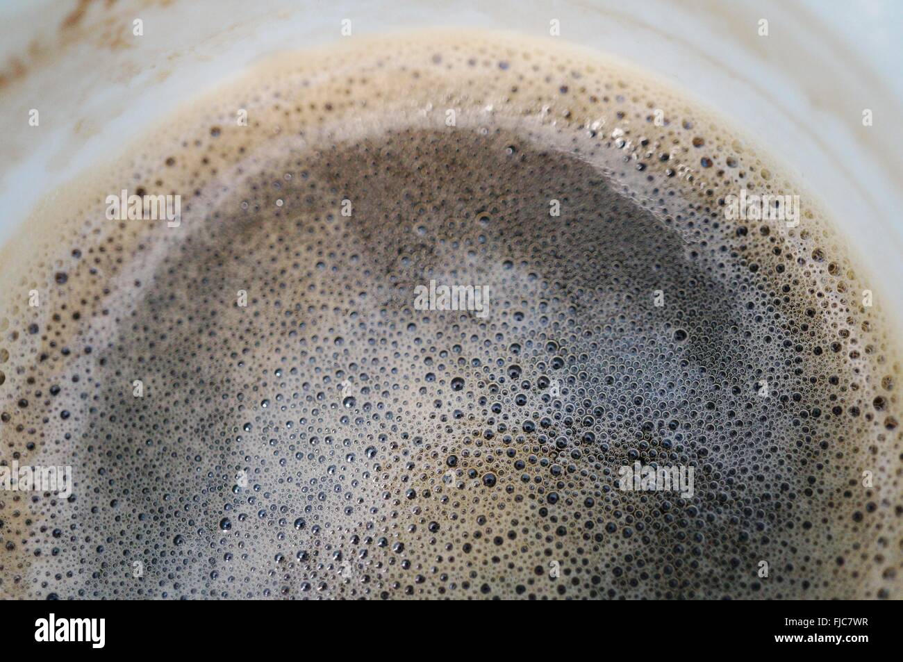The texture at the top surface of a cup of strong coffee Stock Photo ...