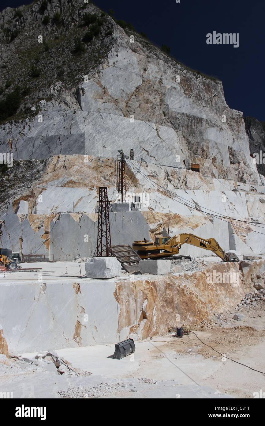 Marble quarry with digger at Carrara, Italy Stock Photo - Alamy